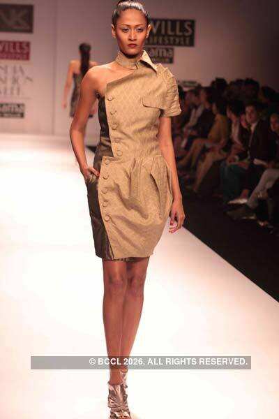 A model presents a creation by designer Narendra Kumar on Day 1 of ...