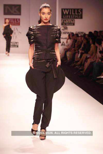 Camilla presents a creation by designer Narendra Kumar on Day 1 of ...