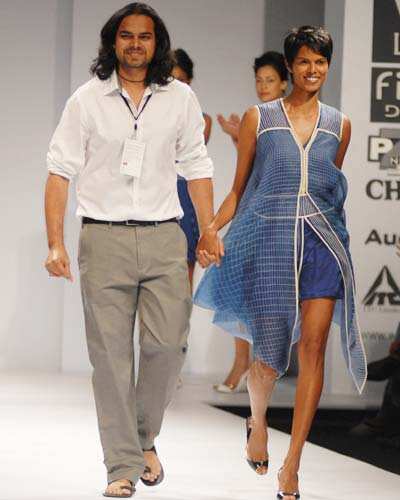 Lisa Haydon presents a creation by designer Rahul Mishra on Day 1 of ...