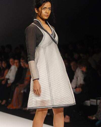 Tinu walks the ramp with designer Rahul Mishra on Day 1 of Wills India ...