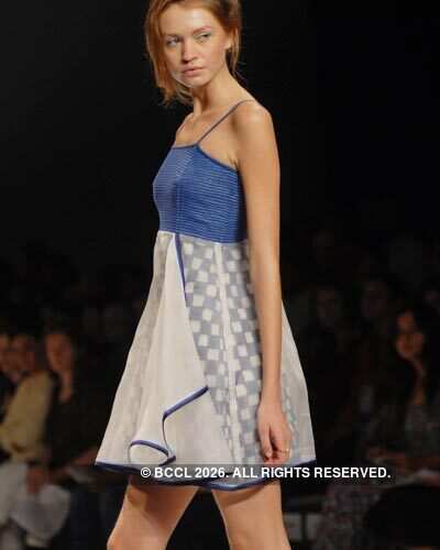 Tinu walks the ramp with designer Rahul Mishra on Day 1 of Wills India ...