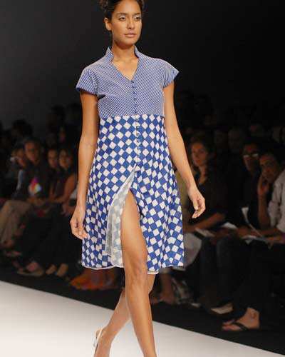 Lisa Haydon presents a creation by designer Rahul Mishra on Day 1 of ...