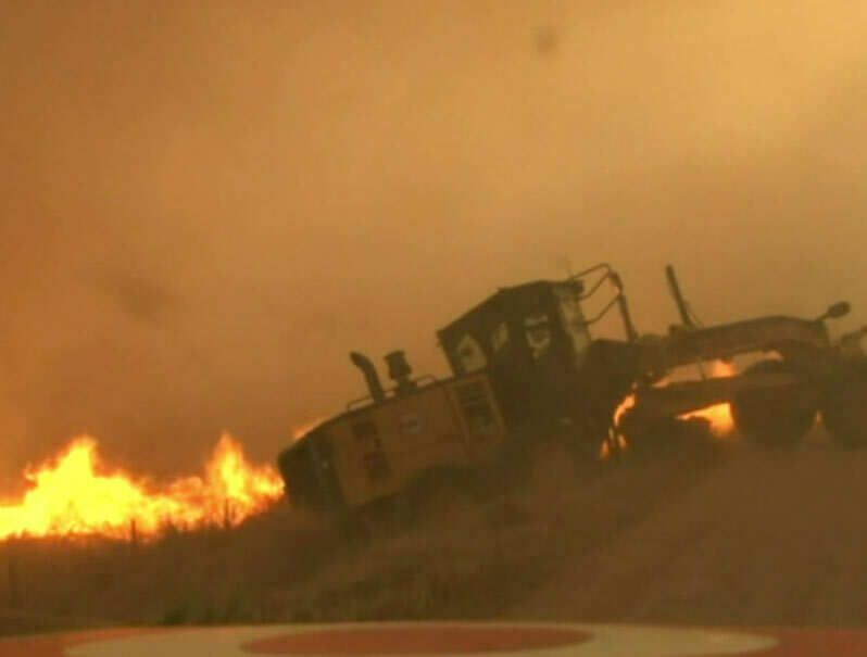 Dramatic! TV crew helps man escape wildfire