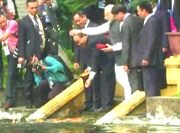 PM Modi feeds fish in uncle Ho's pond in presidential compound