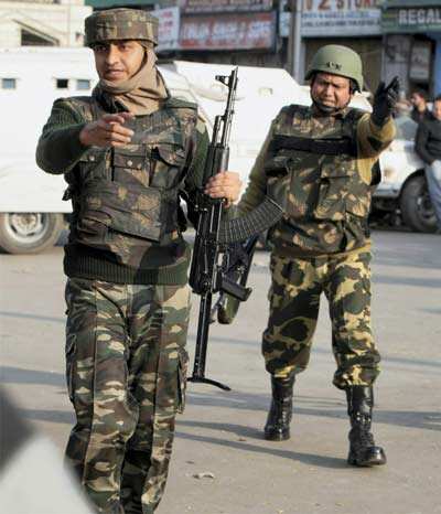 CRPF men ask media persons to stay away during a Fidayeen attack at Lal ...