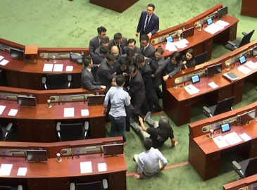 Hong Kong lawmakers scuffle with security