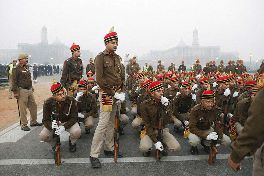 Delhi policemen listen to their instructor during a rehearsal ahead of ...