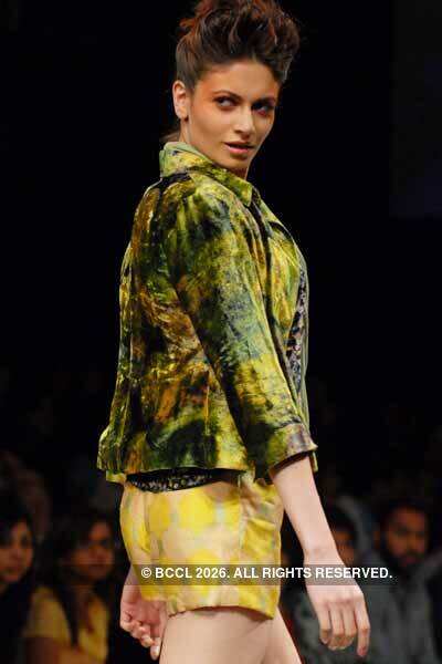 A model walks the runway to showcase a creation by designer Krishna ...