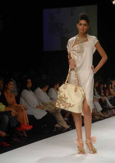 A model displays a creation by Malini Agarwal on 5th and final day of ...