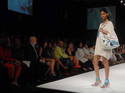 A model displays a creation by Malini Agarwal on 5th and final day of ...