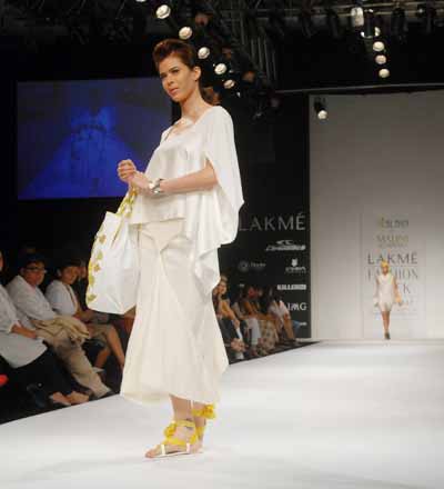 A model displays a creation by Malini Agarwal on 5th and final day of ...