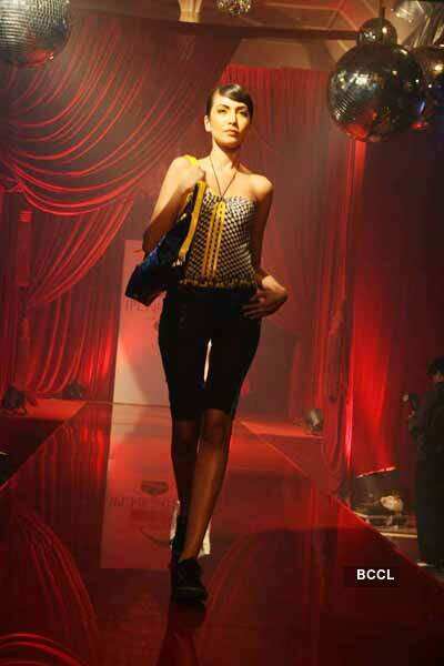 A model walks the ramp during the IPL post party at Trident in Mumbai ...