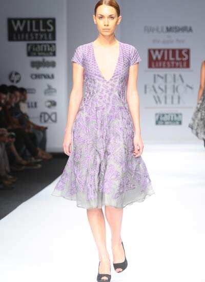 A model presents a creation by designer Rahul Mishra during Wills India ...