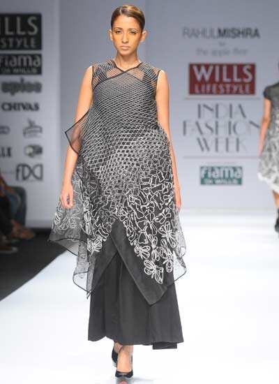 A model presents a creation by designer Rahul Mishra during Wills India ...