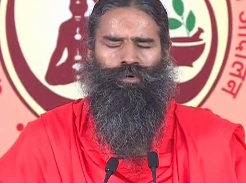 Hundreds followed as Baba Ramdev performed yoga asanas