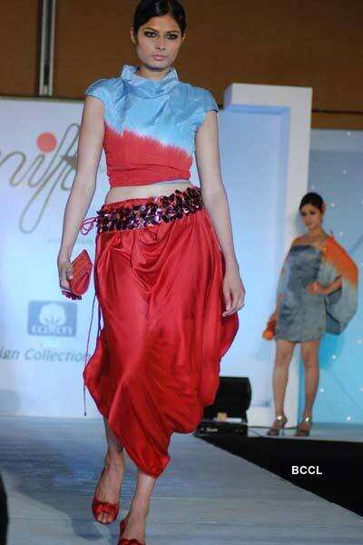 A model walks the ramp to showcase a creation during NIFT annual ...