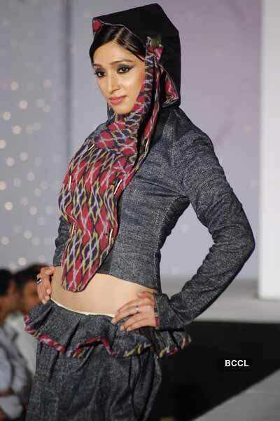 A model walks the ramp to showcase a creation during NIFT annual ...