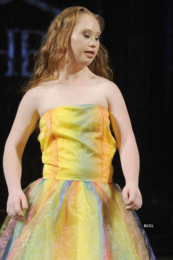 Down syndrome model walks the runway with a giant python, leaves ...