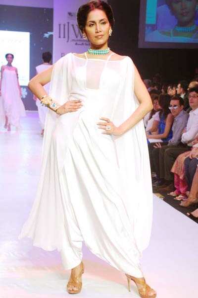 Queenie and Dino Morea walk the ramp during Queenie's show for ...