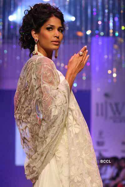 A model showcases a creation by designer Farah Khan during India ...