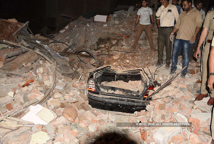 Debris of a collapsed four-storey hotel is removed near the Sarvate bus ... Debris of a collapsed four-storey hotel is removed near the Sarvate bus ...
