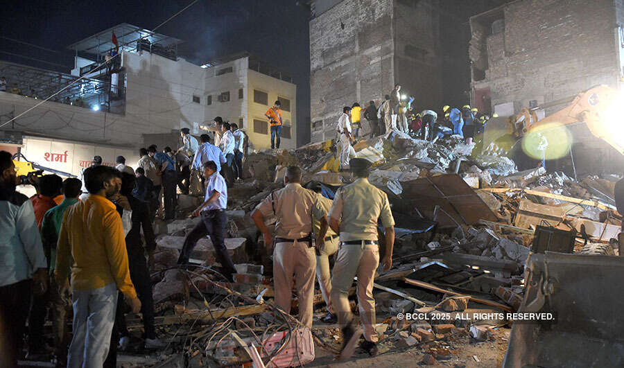 Debris of a collapsed four-storey hotel is removed near the Sarvate bus ... Debris of a collapsed four-storey hotel is removed near the Sarvate bus ...