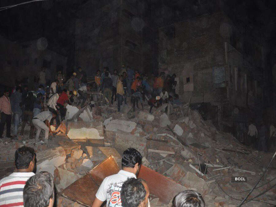 Debris of a collapsed four-storey hotel is removed near the Sarvate bus ... Debris of a collapsed four-storey hotel is removed near the Sarvate bus ...