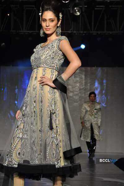 A model showcases a creation by designer Azeem Khan at a fashion show ...