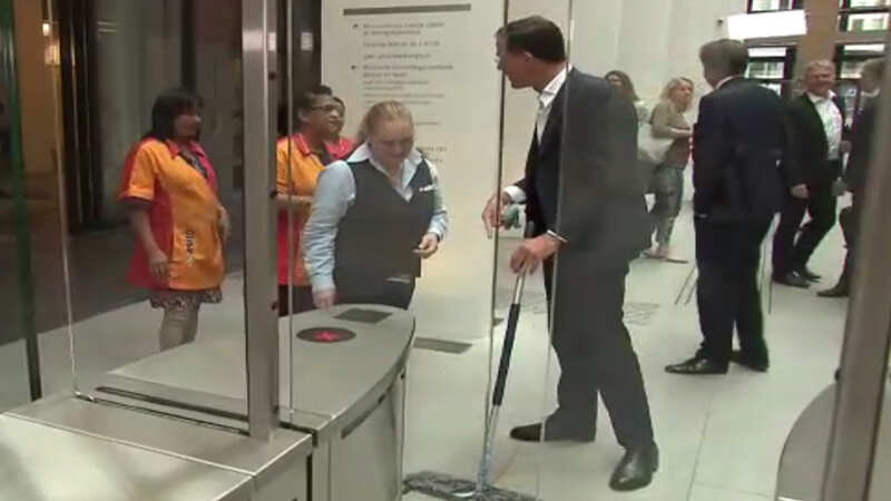 Dutch PM Mark Rutte accidentally drops coffee, mops floor himself