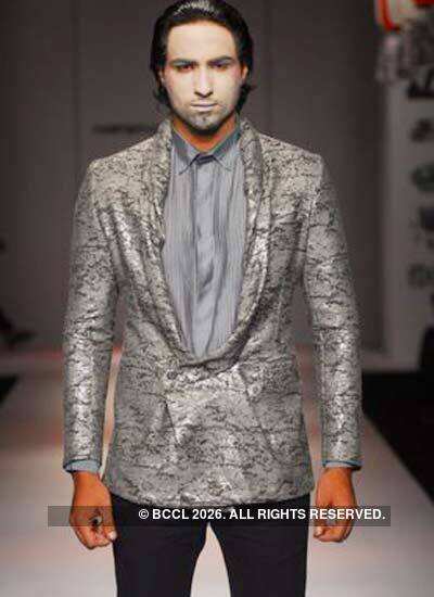 A model presents a creation by designer Narendra Kumar on the Day 1 of ...