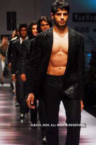 A model presents a creation by designers Karan Johar and Varun Bahl on ...