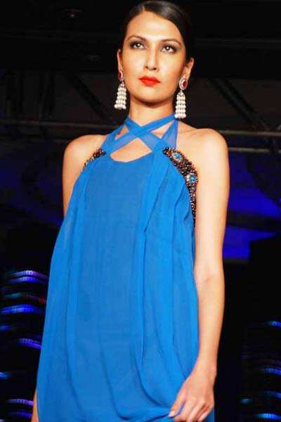 A model displays a creation by designers Rahul and Gunjan on day 2 of ...