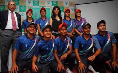 Selected players pose with Kiran Uttam Ghosh (centre in black dress ...