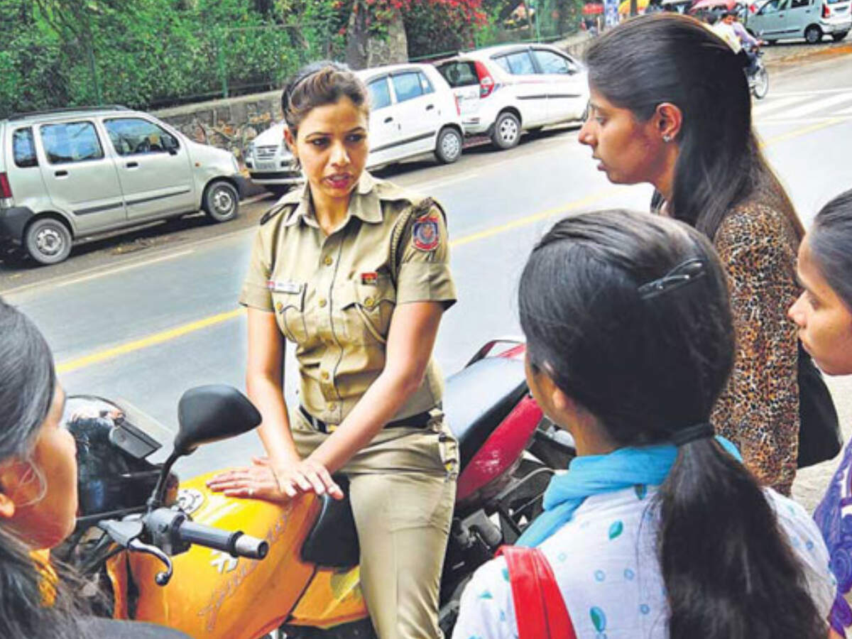 Women riding two-wheelers without wearing a helmet will be fined Rs 300/-