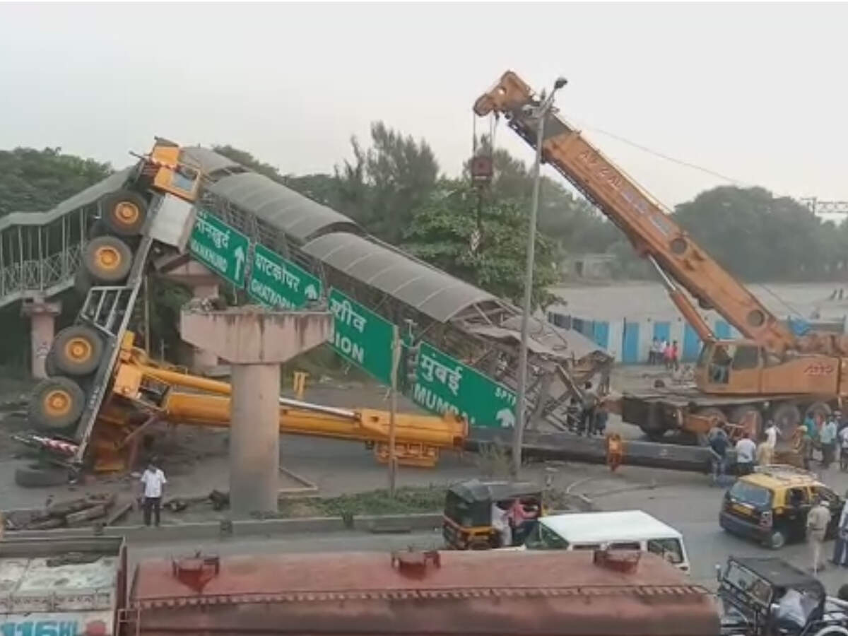Mumbai: Crane falls off while removing foot over bridge on Sion-Panvel ...