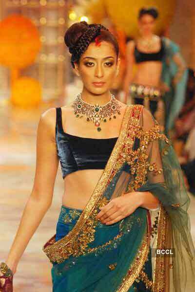 Aishwarya Rai Bachchan showcases a creation by designer Manish Malhotra ...