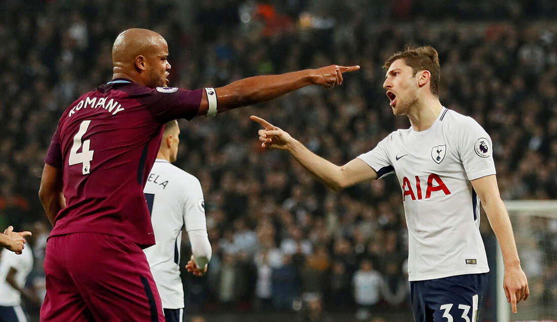 Simon Patmore of Australia lies in the snow after winning the event as ...
