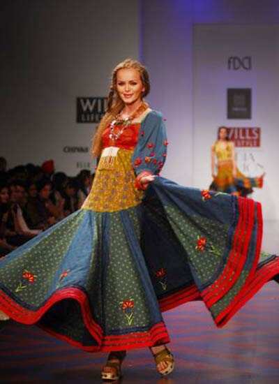 A model displays a creation by designers Ashish Viral and Vikrant on ...