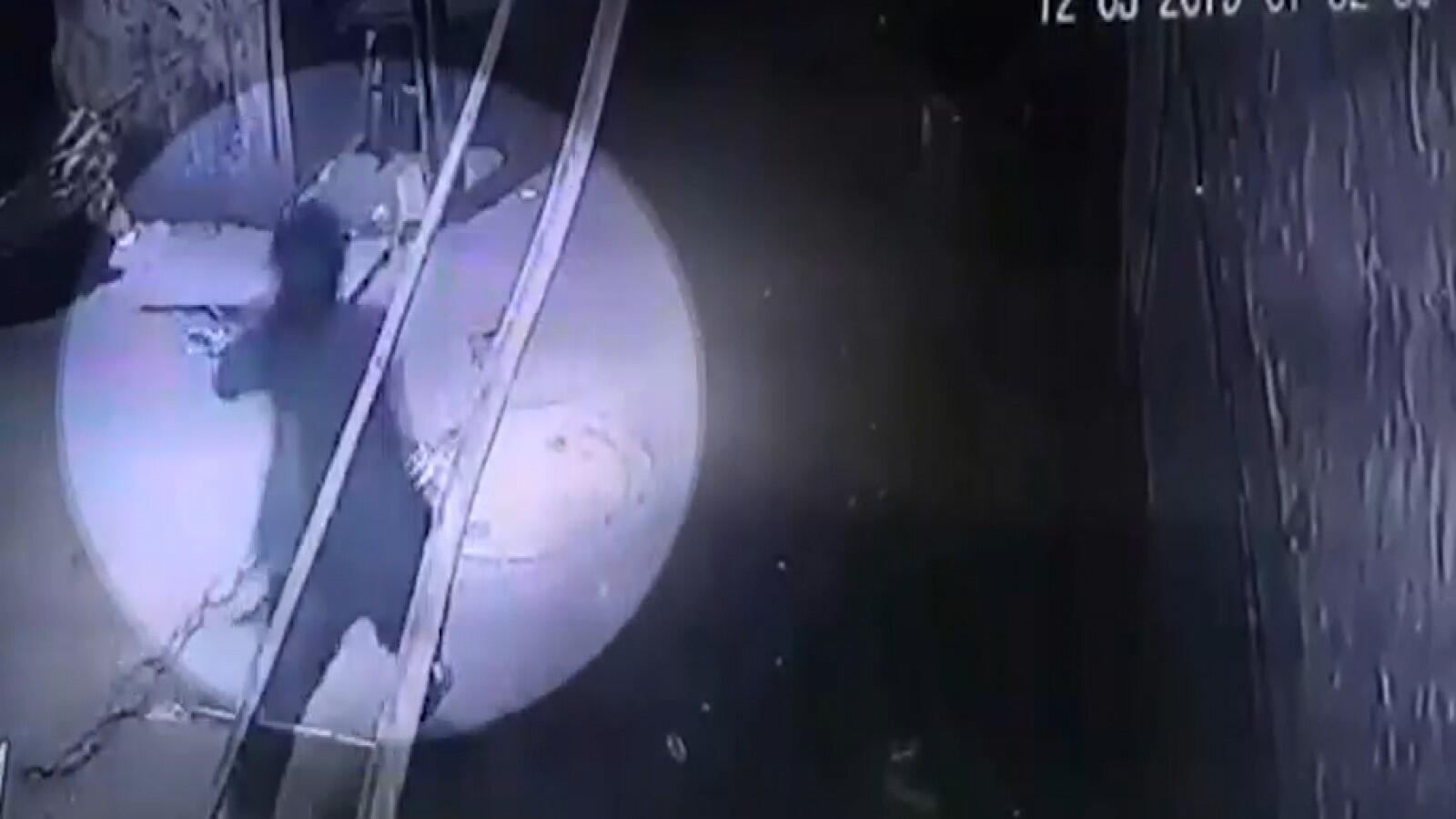 Chilling murder of businessman caught on cam, son battles for life