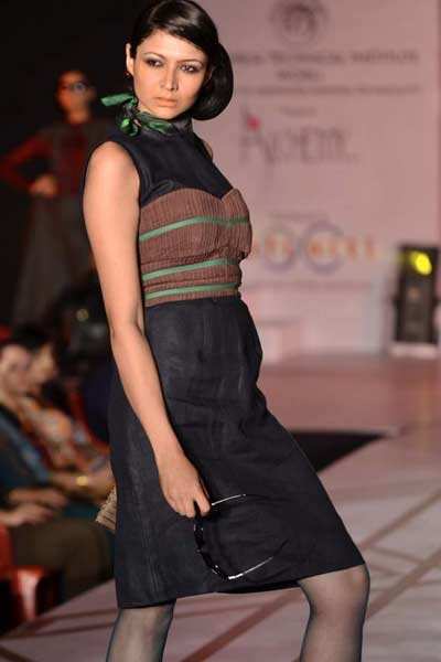 A model showcases a creaton during LS Raheja College's fashion show at ...