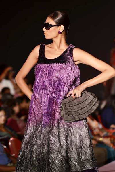 A model showcases a creaton during LS Raheja College's fashion show at ...