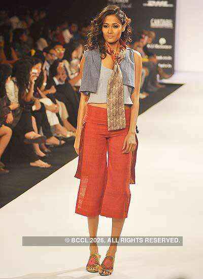 A model showcases a creation by designer Purvi Doshi on Day 5 of the ...