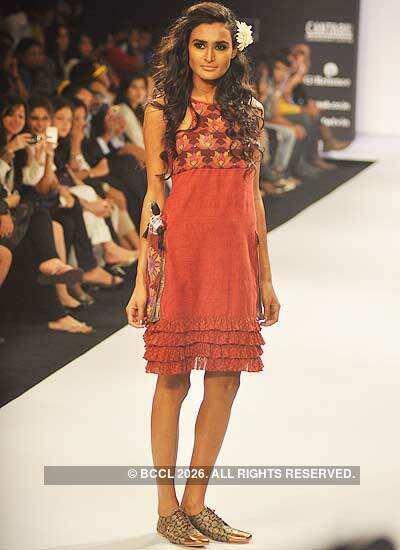 A model showcases a creation by designer Purvi Doshi on Day 5 of the ...