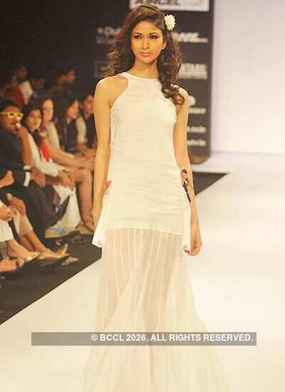 A model showcases a creation by designer Purvi Doshi on Day 5 of the ...
