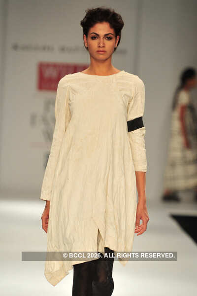 A model showcases a creation by designer Kallol Datta on Day 1 of the ...