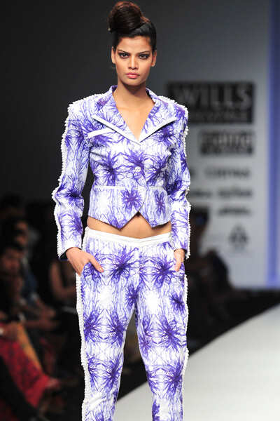 A model showcases a creation by designer Rahul Singh on Day 2 of the ...