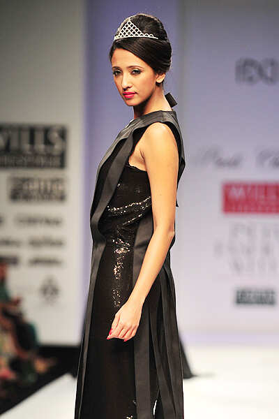 A model showcases a creation by designer Preeti Chandra on Day 2 of the ...