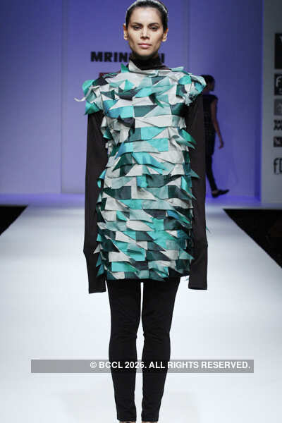 A model showcases a creation by designer Mrinalini on Day 3 of the ...
