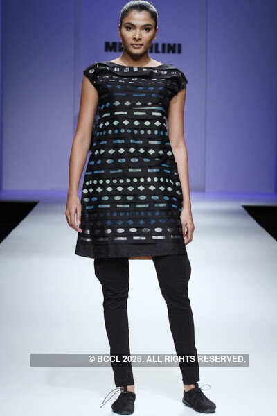 A model showcases a creation by designer Mrinalini on Day 3 of the ...