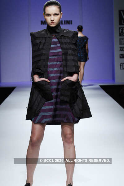 A model showcases a creation by designer Mrinalini on Day 3 of the ...